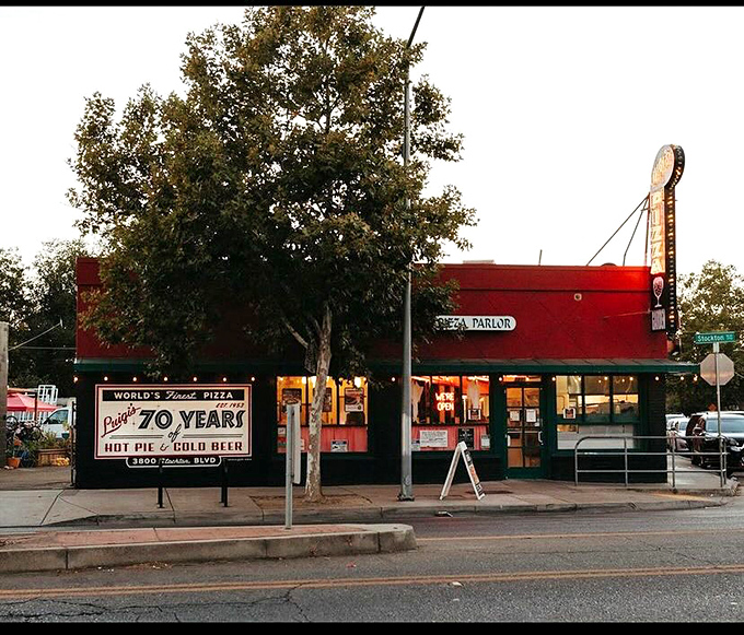 That classic red building with "70 YEARS" on the sign isn't just bragging &ndash; it's promising decades of pizza perfection in every bite.