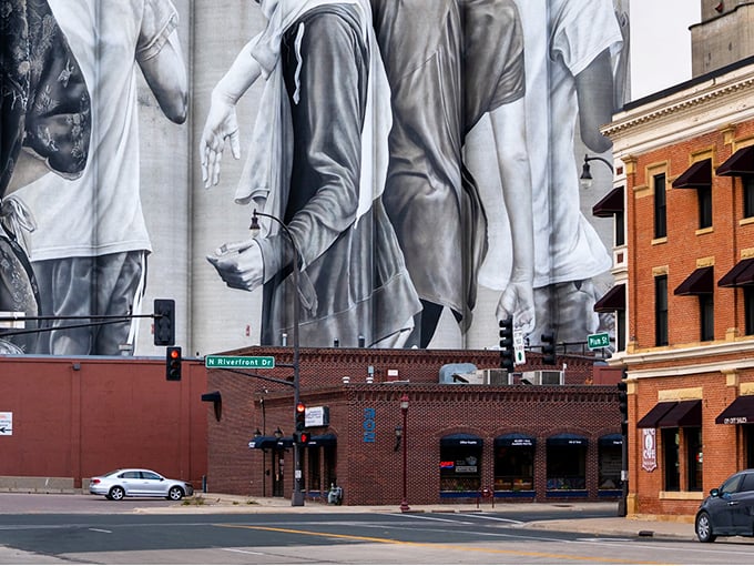 Downtown Mankato's stunning mural transforms ordinary brick into extraordinary art. This riverside gem balances small-town charm with big-city culture.