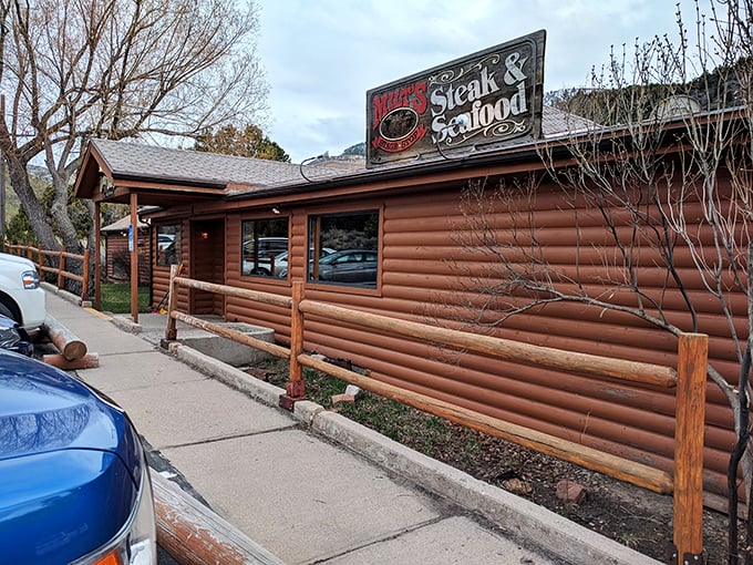 Milt's rustic log cabin exterior looks like the secret clubhouse where steaks go to fulfill their delicious destiny. A hidden gem worth finding!