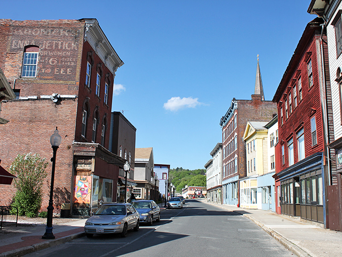 Historic brick buildings stand proudly along Main Street, where time seems to slow down and your wallet stays happier.