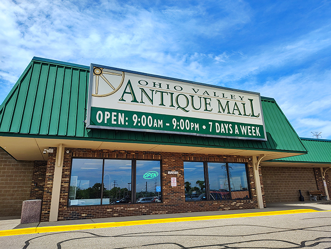 The green-roofed wonderland of Ohio Valley Antique Mall beckons treasure hunters with its promise of endless discoveries inside.