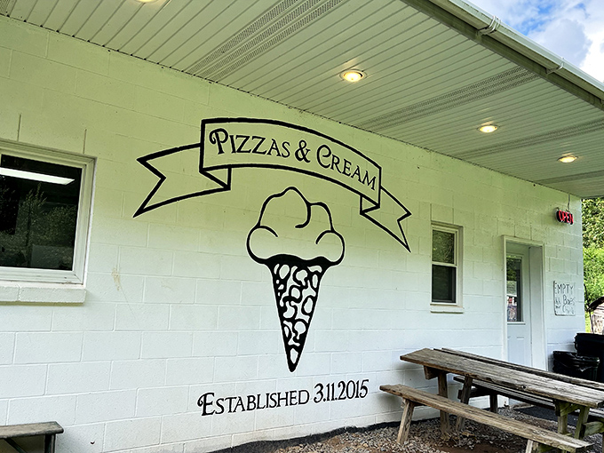 The simple white building with "Pizzas & Cream" painted on the side promises two of life's greatest pleasures under one humble roof.