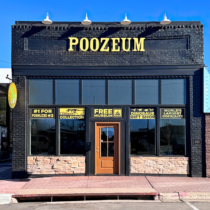 The Poozeum's bold black facade with bright yellow lettering promises a prehistoric adventure into the world's most fascinating fossilized feces.