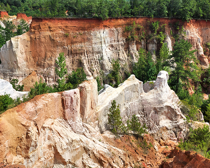 Providence Canyon's layered walls look like nature's own layer cake &ndash; if Georgia had been baking with crayons instead of flour!
