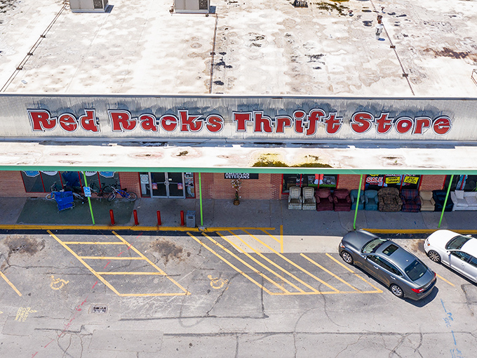 Red Racks' iconic storefront promises treasure hunting adventures behind those brick walls. The red sign beckons like a siren song to thrift enthusiasts.