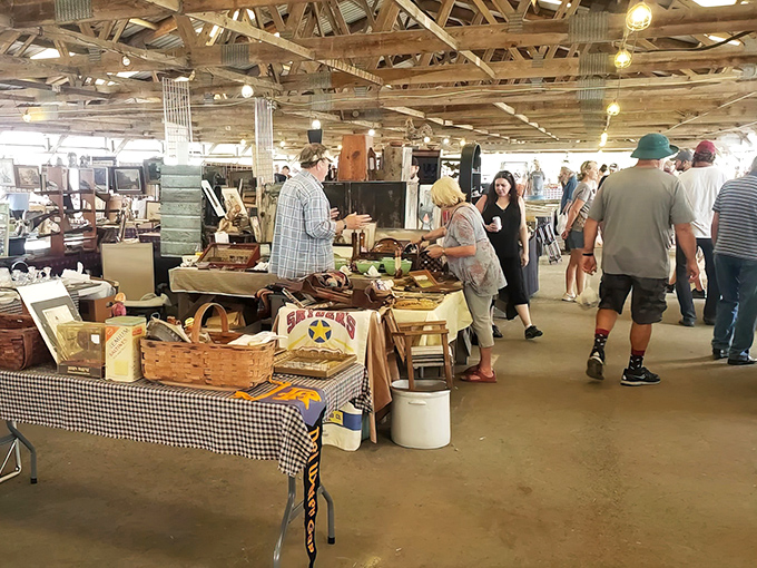 Treasure hunters navigate the wooden-beamed wonderland of Renninger's, where every table holds potential gold.