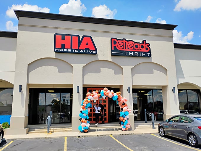 The colorful balloon arch welcomes treasure hunters to Retreads Thrift, where "Hope Is Alive" and bargains await!