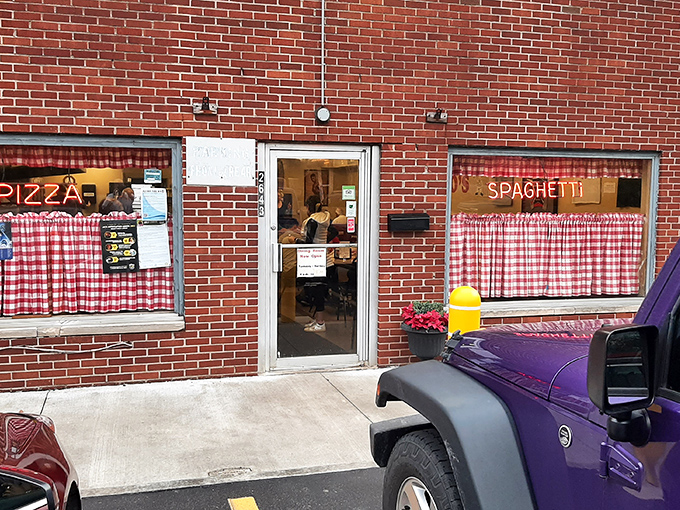 The red checkered curtains at Rubino's aren't just decoration&mdash;they're a promise that pizza tradition lives here!