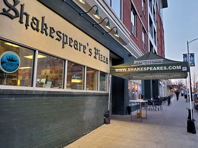Shakespeare's iconic storefront beckons with literary flair and the promise of pizza that would make the Bard himself break into sonnets.