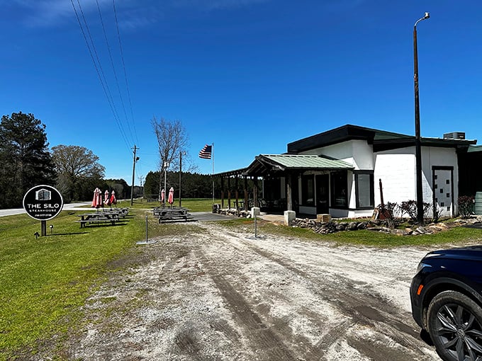 The Silo Steakhouse stands proud against Georgia's blue sky, a rustic outpost where meat lovers make delicious pilgrimages.