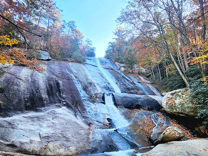 Stone Mountain's waterfall cascades down smooth granite like nature's own water slide. Pure magic in motion!
