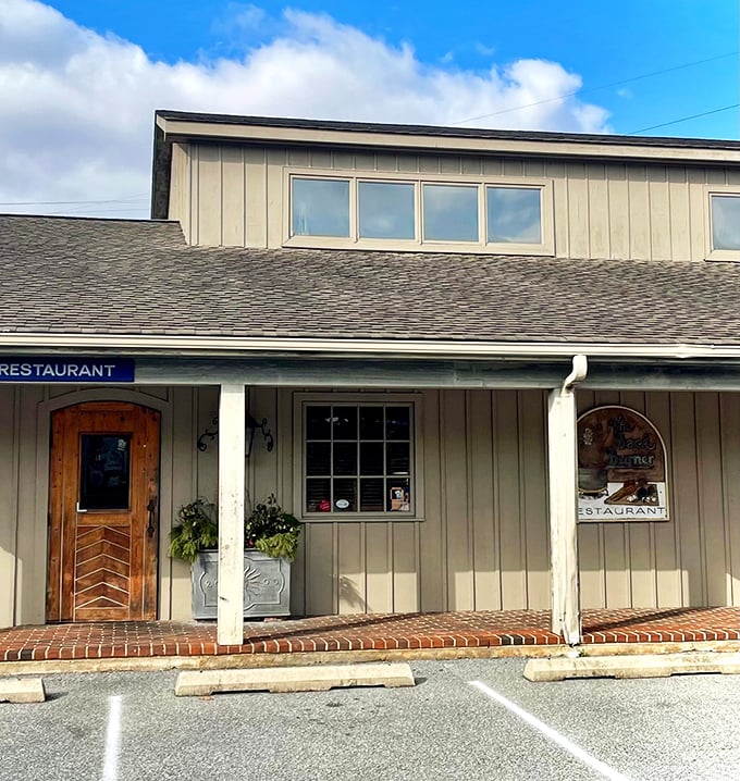 The Back Burner's charming wooden door and welcoming porch promise comfort food magic within. Like finding a secret clubhouse for grown-ups!