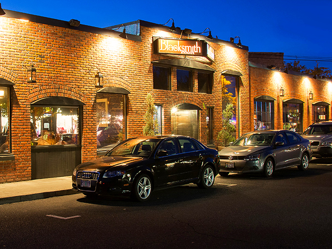 The Blacksmith's brick exterior glows at twilight, promising steaks that could make a vegetarian reconsider their life choices.