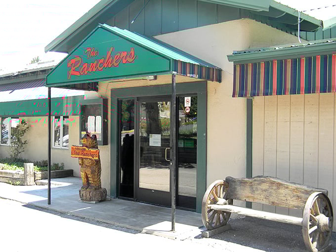 The Ranchers' wooden bear welcomes you like an old friend. That rustic bench outside practically begs you to sit and digest after your steak feast!