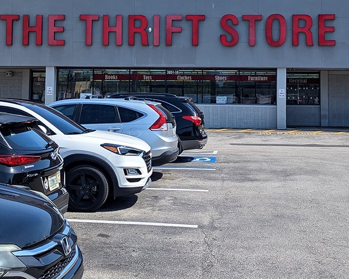 The bright red sign beckons like a lighthouse for bargain hunters, promising treasures inside this Jacksonville gem.