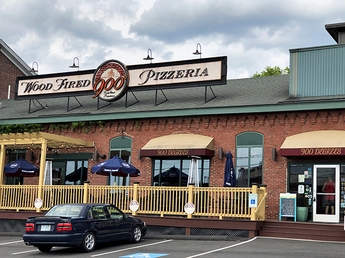 That "Wood Fired" sign isn't just decoration - it's a promise of pizza magic happening inside those brick walls.