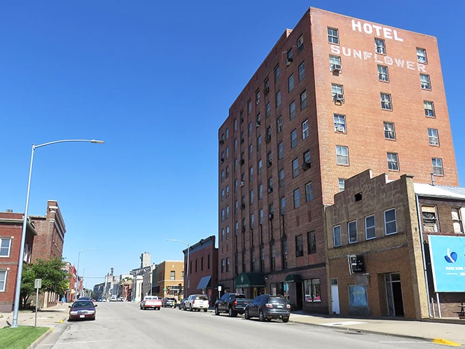 The iconic Hotel Sunflower stands tall against the Kansas sky, a brick sentinel watching over Abilene's affordable streets.