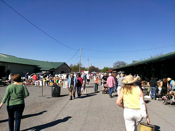 Bargain hunters paradise in action. The thrill of the hunt draws crowds to this massive outdoor market where haggling is an Olympic sport.