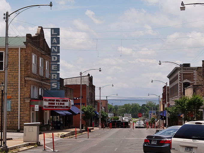 The Landers Theater sign stands tall over Batesville's Main Street, a beacon of entertainment in this charming riverside town.