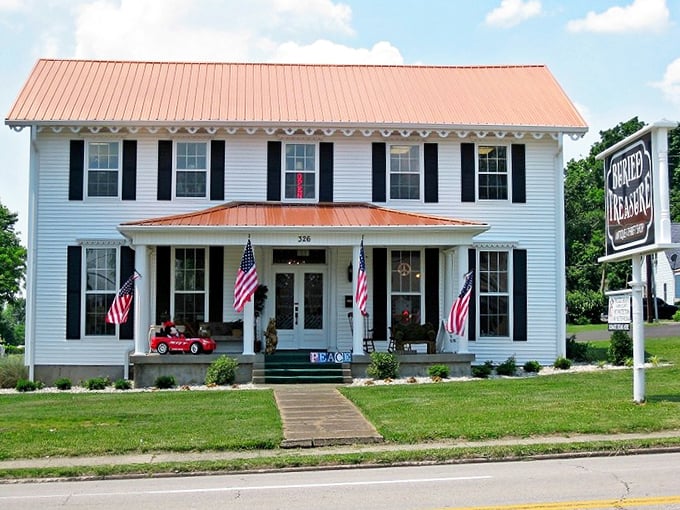 American flags flutter on the porch of this charming thrift haven, where yesterday's treasures find new homes today.