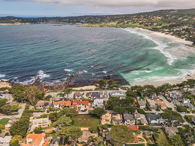The curve of Carmel's shoreline cradles homes that seem to whisper, "Yes, people actually live here, and no, they never get tired of it."