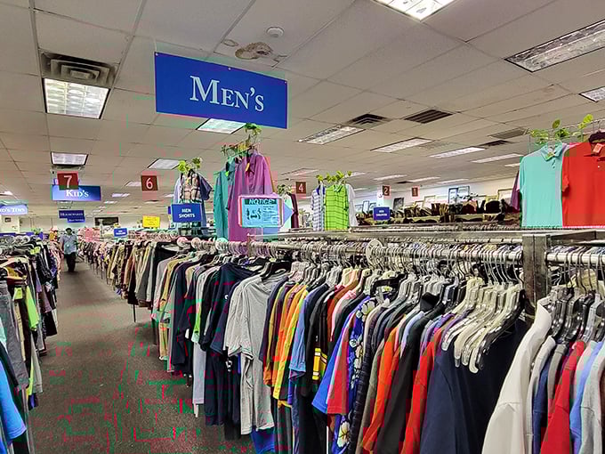 Rows upon rows of men's clothing stretch into the distance. It's like a rainbow made of button-downs and polo shirts!