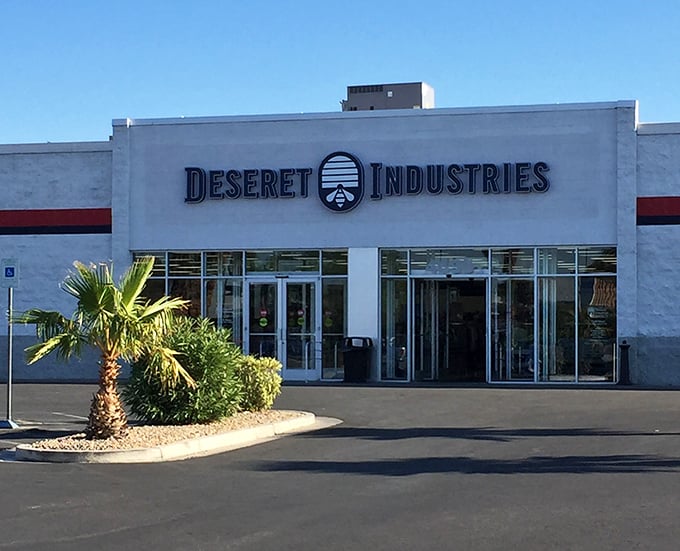 Desert palm meets desert deals! This Deseret Industries outpost stands ready for eager bargain hunters with its welcoming facade.