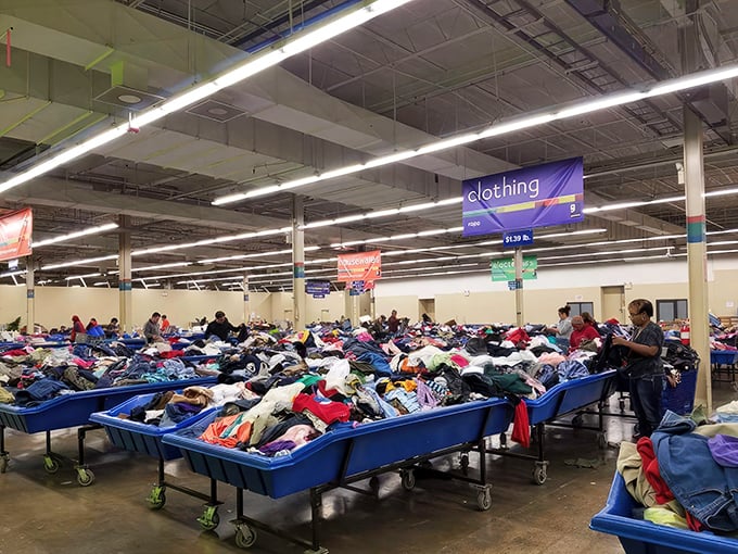 Treasure hunting paradise! Blue bins overflowing with potential fashion finds stretch as far as the eye can see.