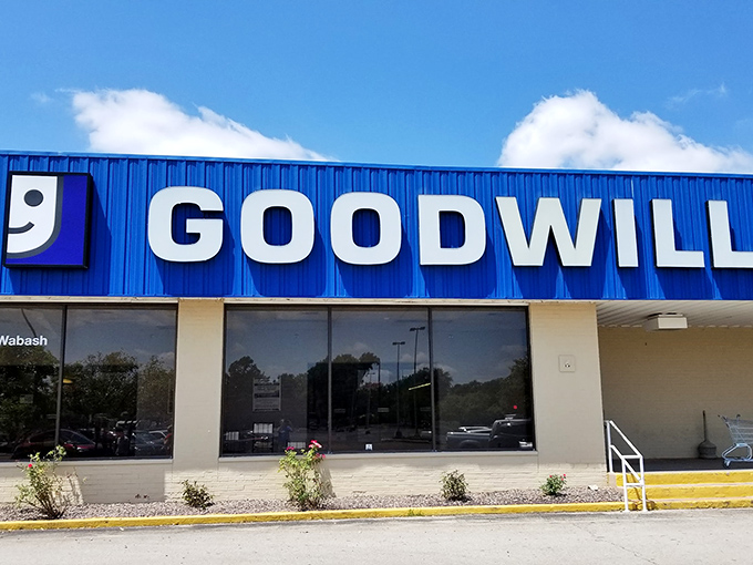Bright blue against the Illinois sky, this Goodwill's cheerful facade has welcomed generations of thrifty shoppers seeking hidden gems.