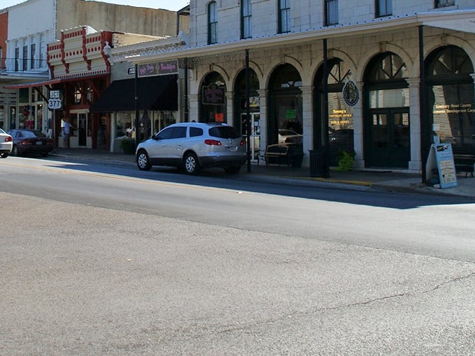 Red brick streets invite leisurely strolls past storefronts that remember when handshakes sealed every deal.