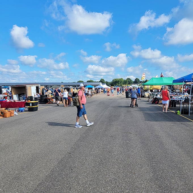 The outdoor market at Hartville buzzes with shoppers under blue skies. Treasure hunting paradise with endless rows of possibilities.