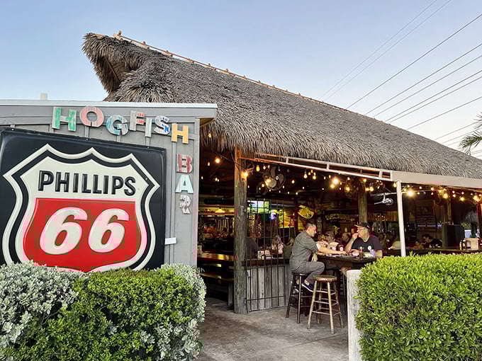 Old Florida charm meets seafood paradise. That Phillips 66 sign and thatched roof tell you this place cares more about flavor than fancy tablecloths.