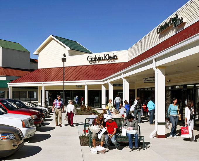Shoppers stroll between stores at Edinburgh Premium Outlets, where red-roofed buildings house treasures at prices that won't make your wallet weep.