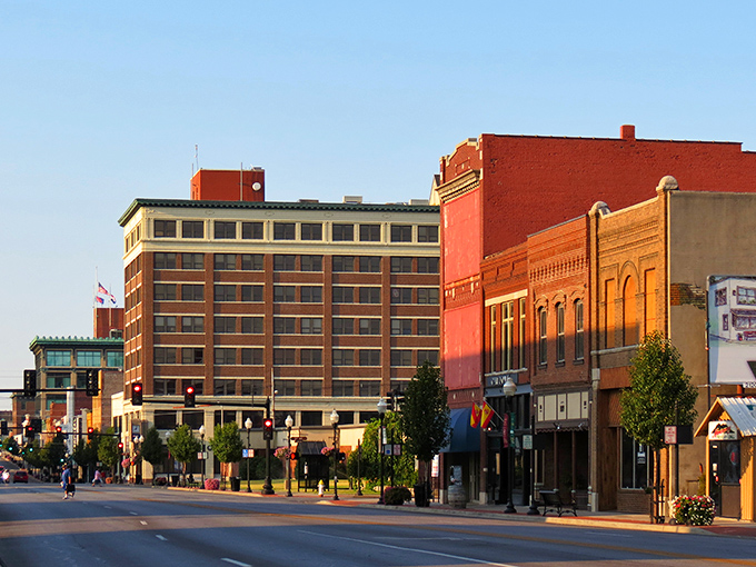 Sunset casts a golden glow on Joplin's Main Street, where retirement dollars stretch further than your morning walk.