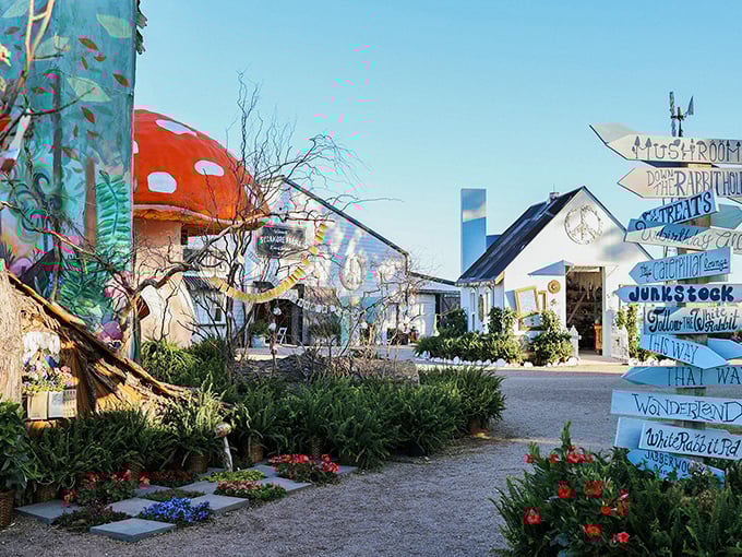 Whimsical signs point the way through Junkstock's colorful village of vendors. Follow the arrows to your next great find!