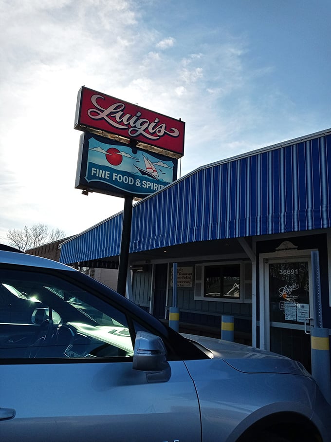 That classic pizzeria sign promises what every Michigander craves – a perfect pie worth pulling over for.