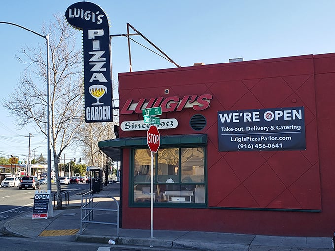 The vintage "Pizza Garden" sign beckons like an old friend, promising the comfort of red-sauce Italian that never goes out of style.