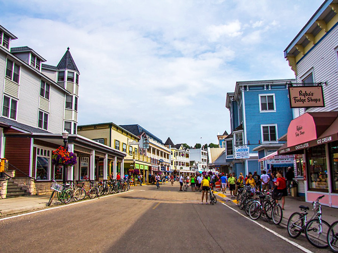 No cars, no problem! Mackinac Island's colorful storefronts and bike-lined streets make time travel feel possible.