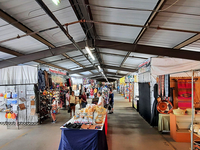 Vendors line this covered walkway like a gauntlet of temptation. One minute you're "just browsing," three hours later you're hauling home southwestern pottery.