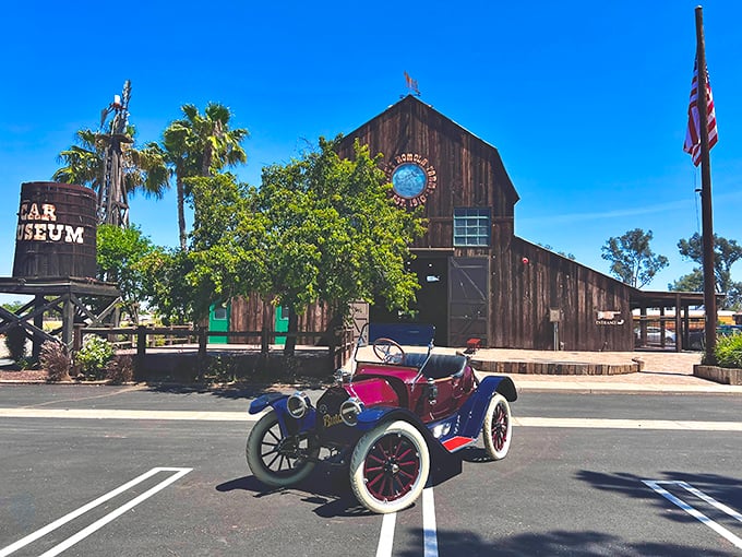 A vintage beauty poses outside this rustic barn-turned-museum. Like finding a mechanical diamond in the rough of Menifee's countryside!