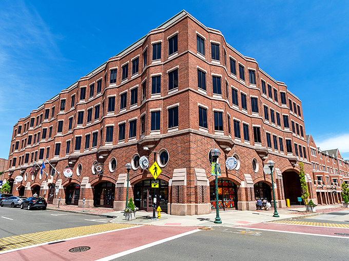 Brick-faced buildings with charming round windows create a welcoming downtown atmosphere in New Haven's shopping district.