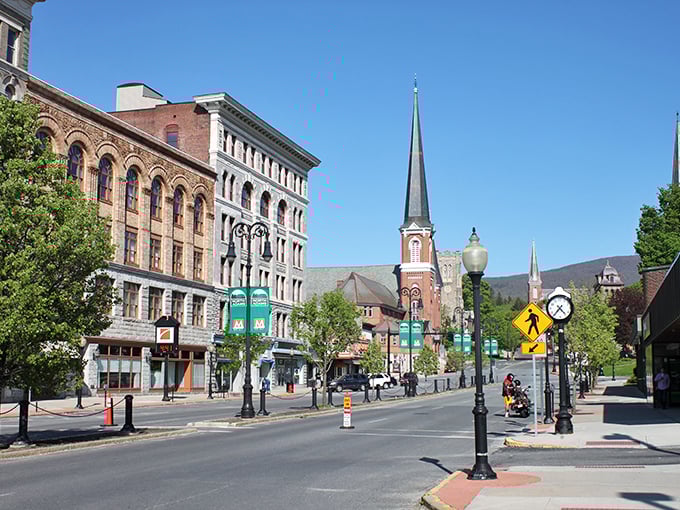 Church spires reach skyward above colorful storefronts, creating that perfect New England postcard scene without the Boston price tag.