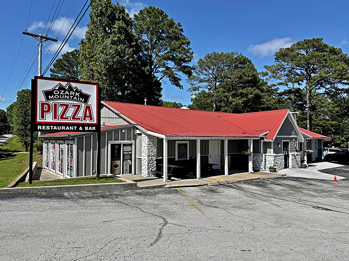 Stone and steel meet comfort food dreams - this roadside gem proves great pizza needs great curb appeal.