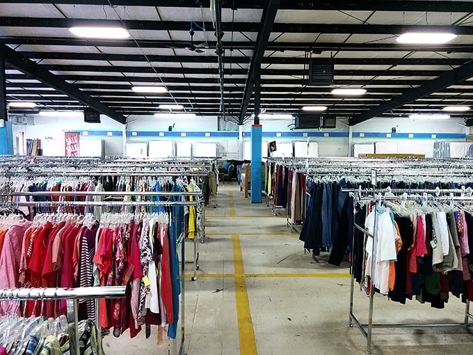 Clothing racks stretch to the horizon at Palmer Home Thrift Store. The yellow floor guides you like a fashionable yellow brick road to bargain paradise.