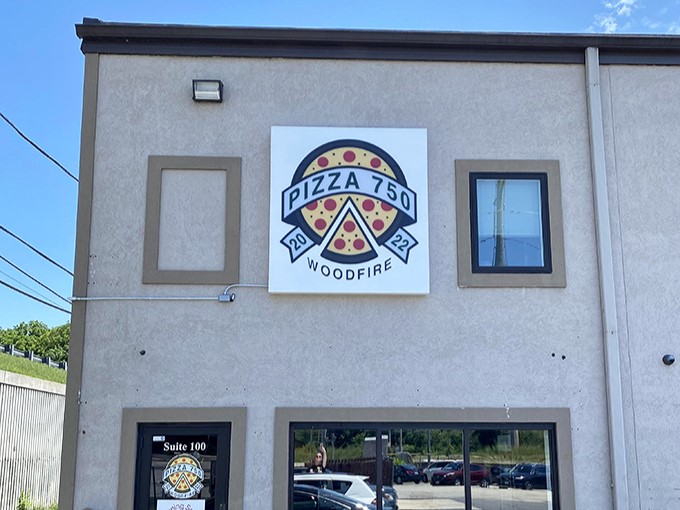 That bold "WOODFIRE" sign isn't just decoration&mdash;it's a promise of pizza magic happening inside those brick ovens.