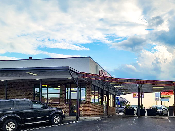 No fancy frills needed when the pizza inside is this legendary. Just follow the red trim to flavor town!