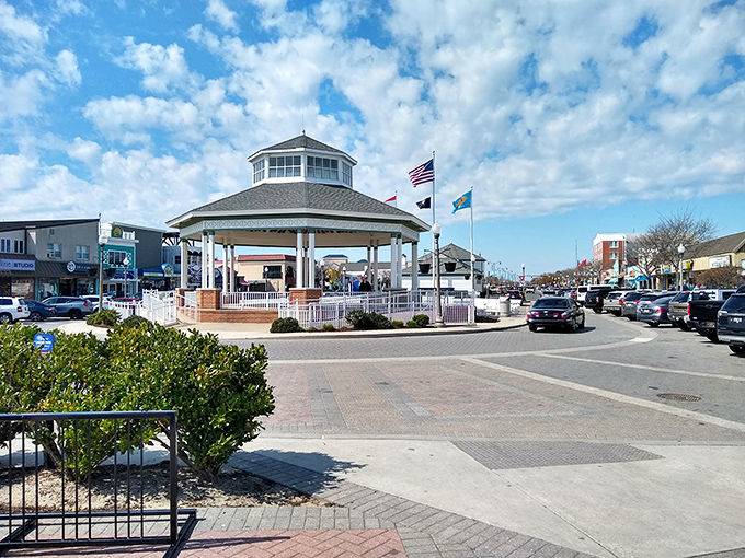 The iconic bandstand gazebo stands as Rehoboth Beach's community heart, where locals gather for free concerts under Delaware's big blue sky.