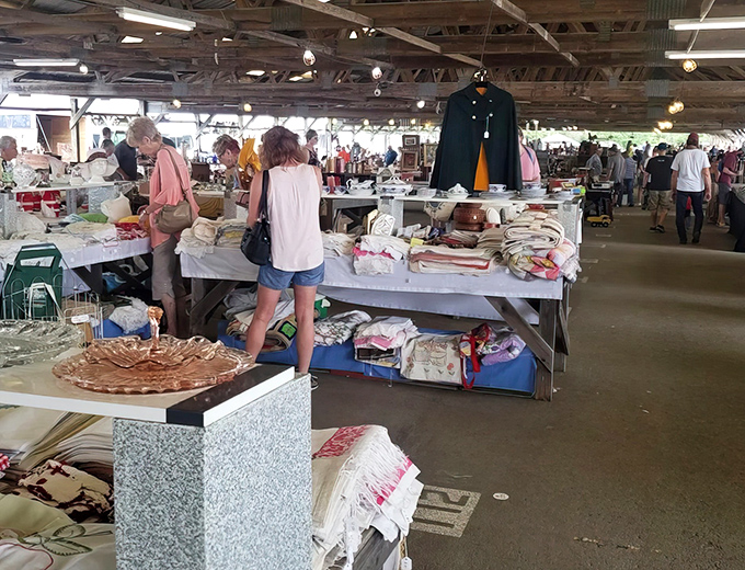 Vintage linens and handcrafted baskets await new homes at Renninger's, a paradise where yesterday's treasures become tomorrow's heirlooms.