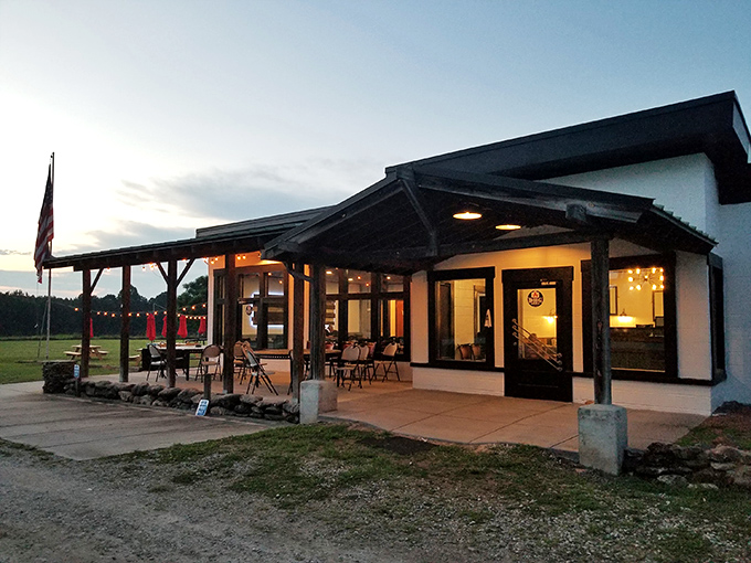 As dusk falls, The Silo transforms into a beacon of beef brilliance, its warm glow promising carnivorous delights within.