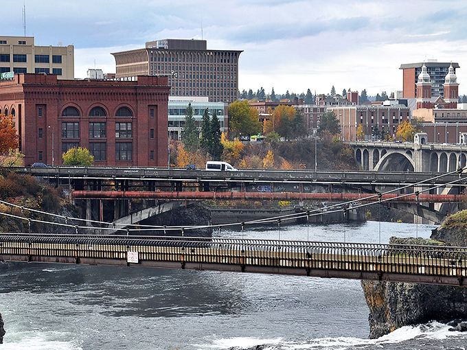 The Spokane River flows beneath historic bridges, connecting neighborhoods where your retirement dollars stretch like saltwater taffy.